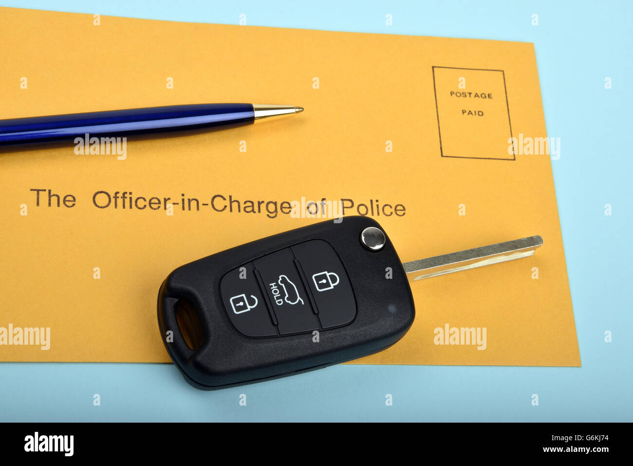 car key and blue pen with a police postage envelope Stock Photo - Alamy