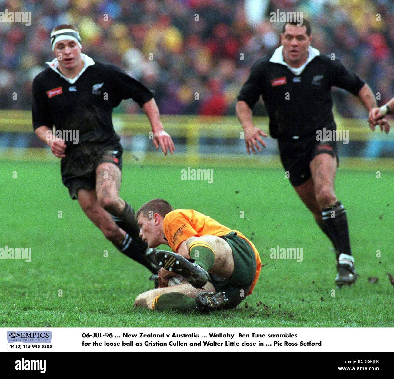 Wallaby Ben Tune scrambles for the loose ball as Cristian Cullen and ...