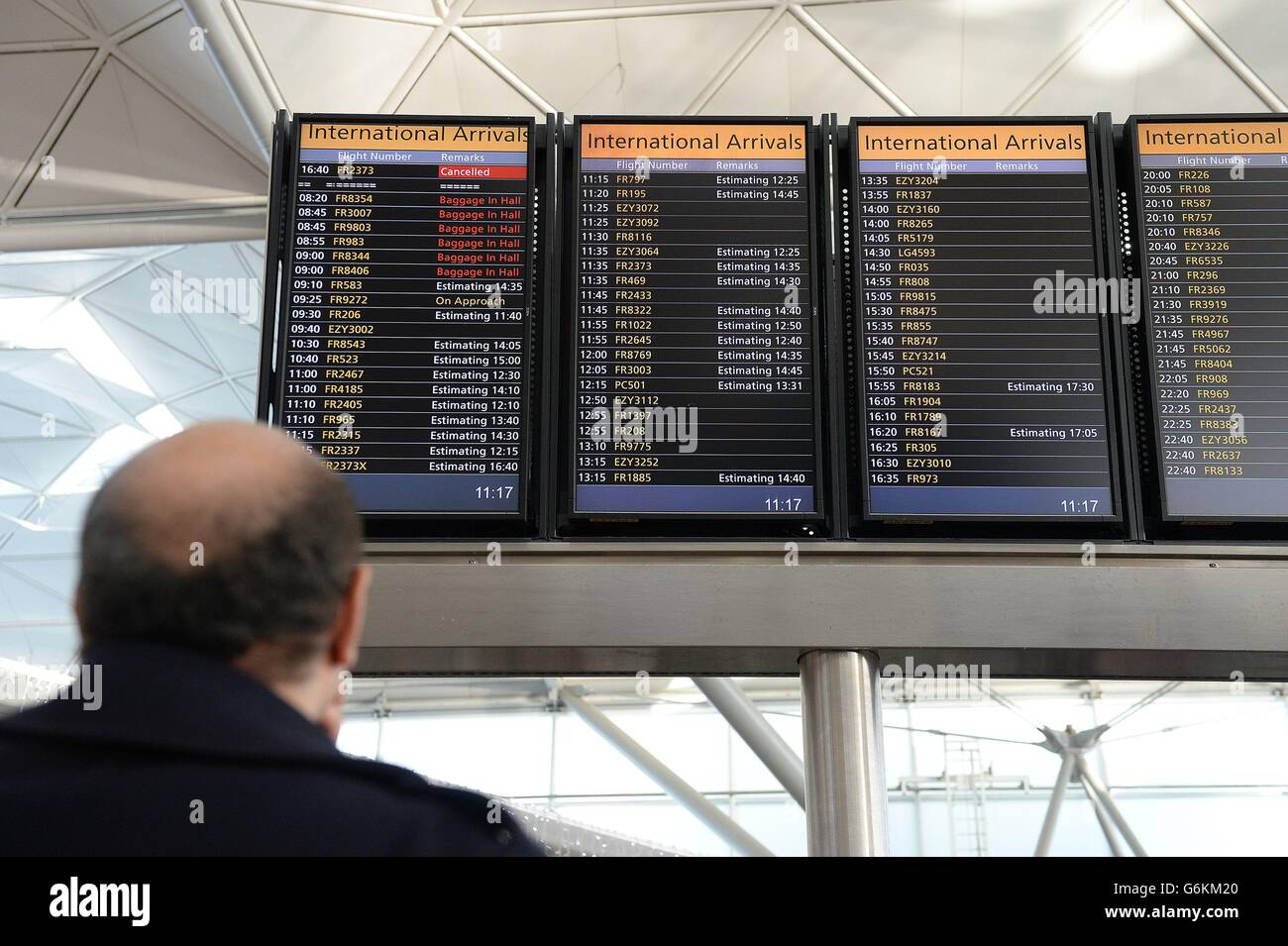 A flight information board at stansted airport hi-res stock photography ...