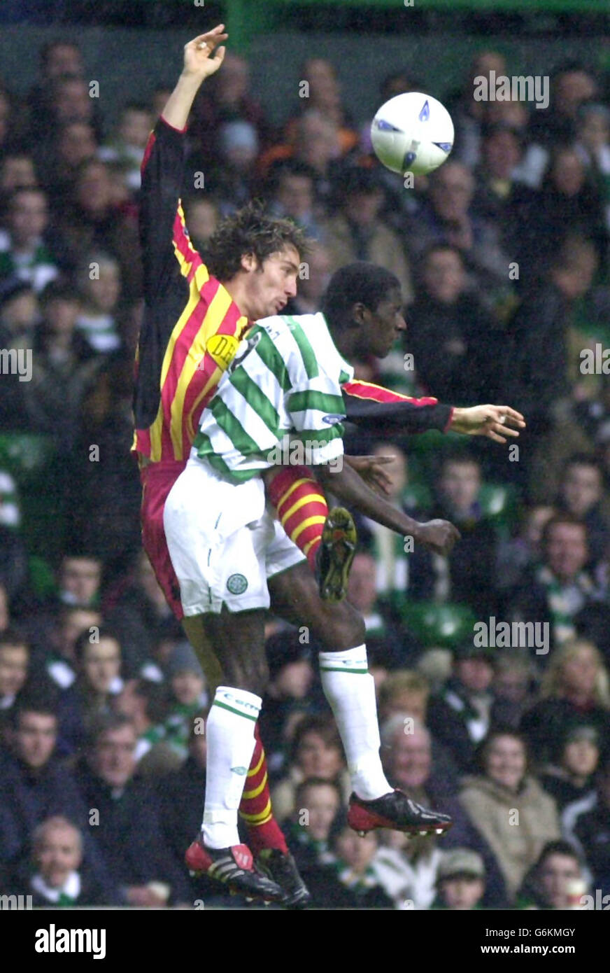 Celtic's Momo Sylla challenges Partick Thistle's Kenny Milne (L) during ...