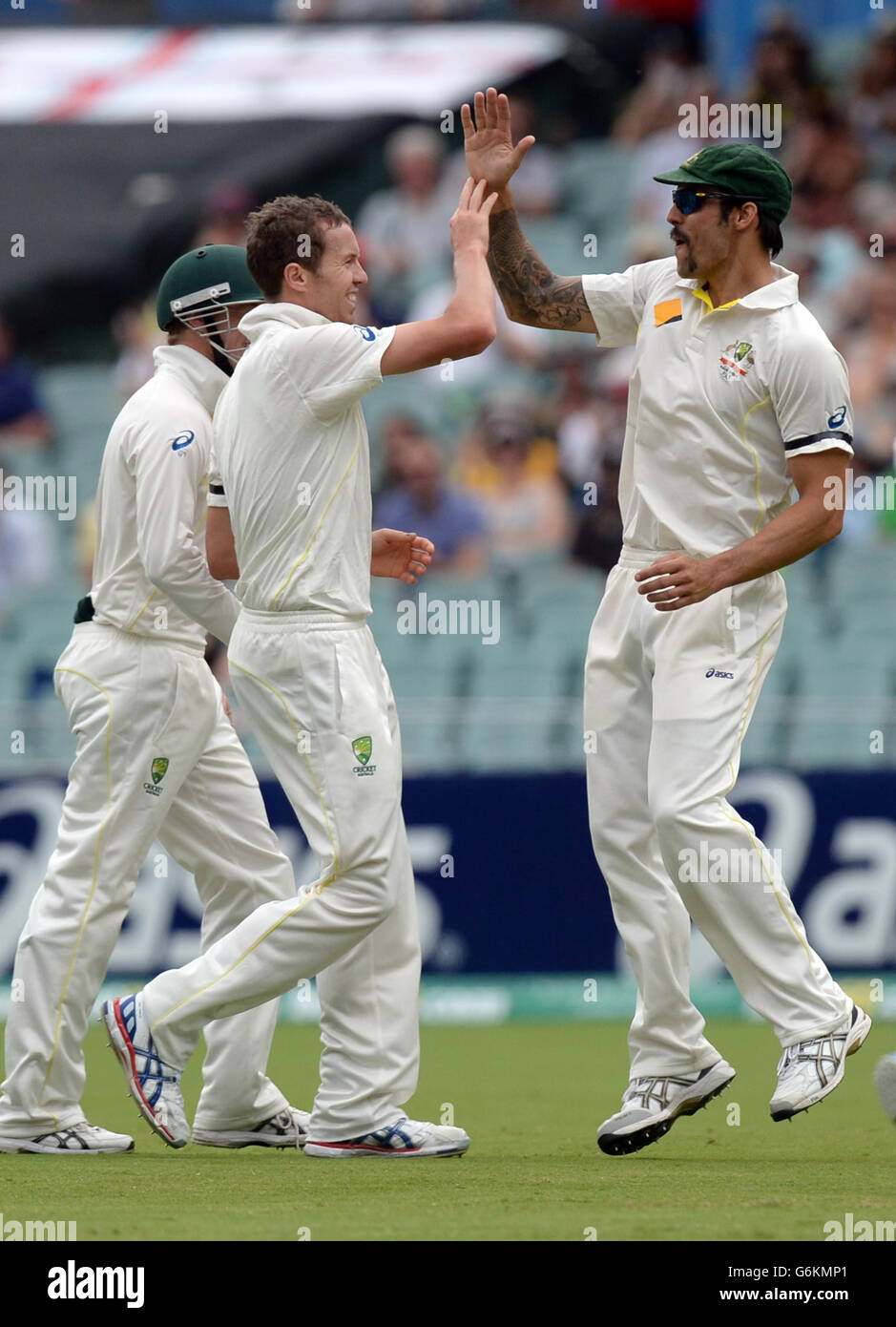 Australia's Peter Siddle (left) celebrates with Mitchell Johnson (right ...