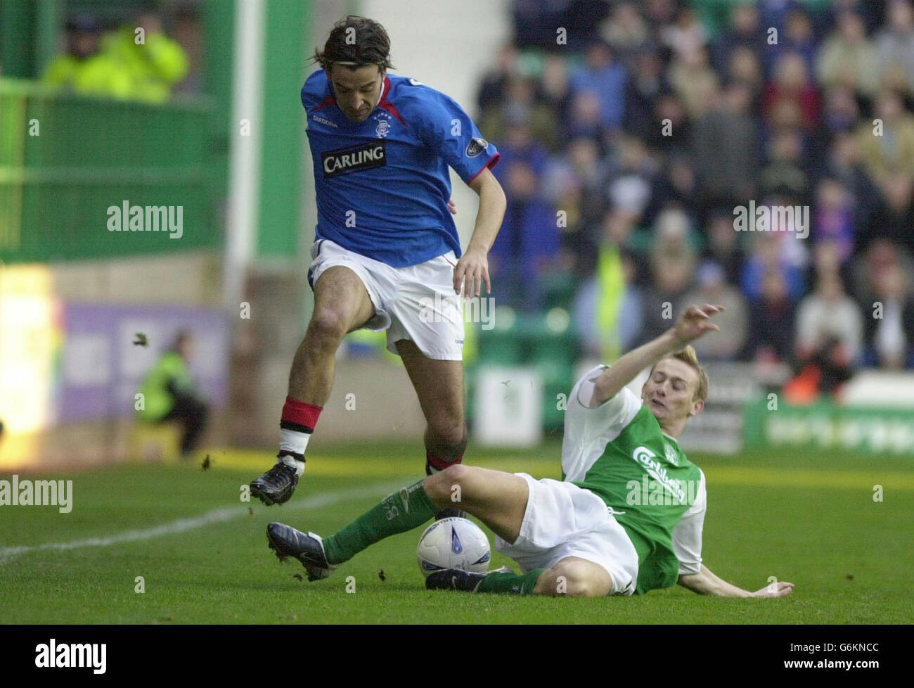 Rangers' Nuno Capucho (left) challenges Hibernian's Derek Riordan ...
