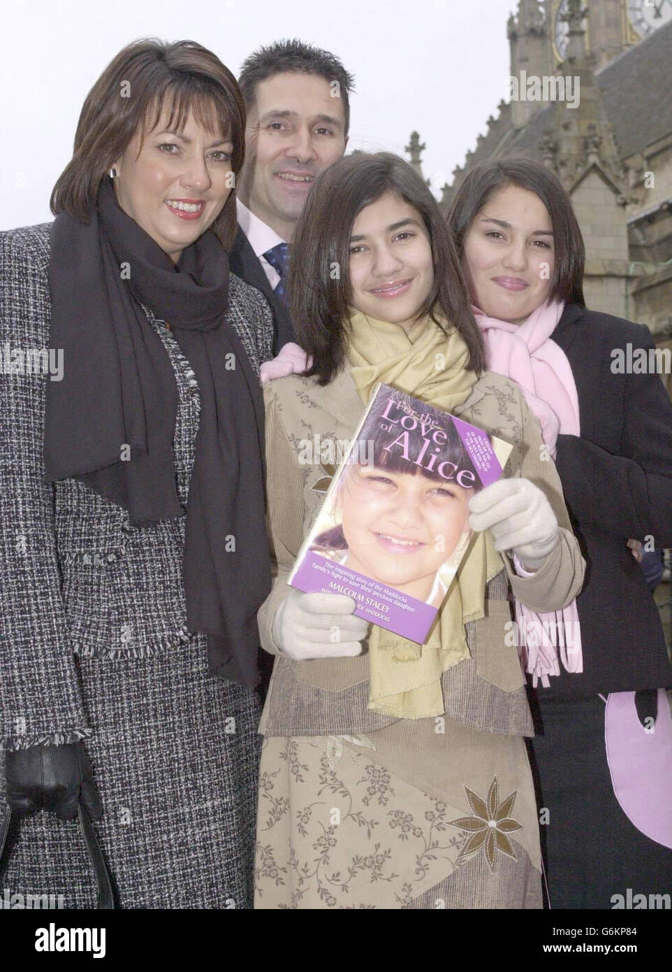 11-year-old Alice Maddocks, holds aloft her book as she arrives at ...