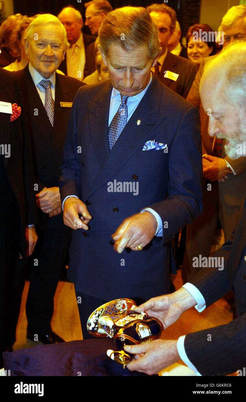 The Prince of Wales looks at the Imari patterned paperweight shire ...