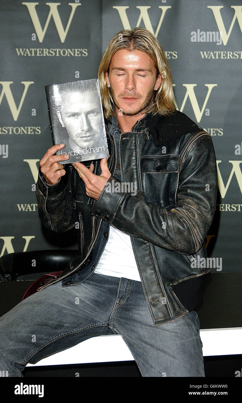England footballer david beckham signs copies of his new book hi-res ...