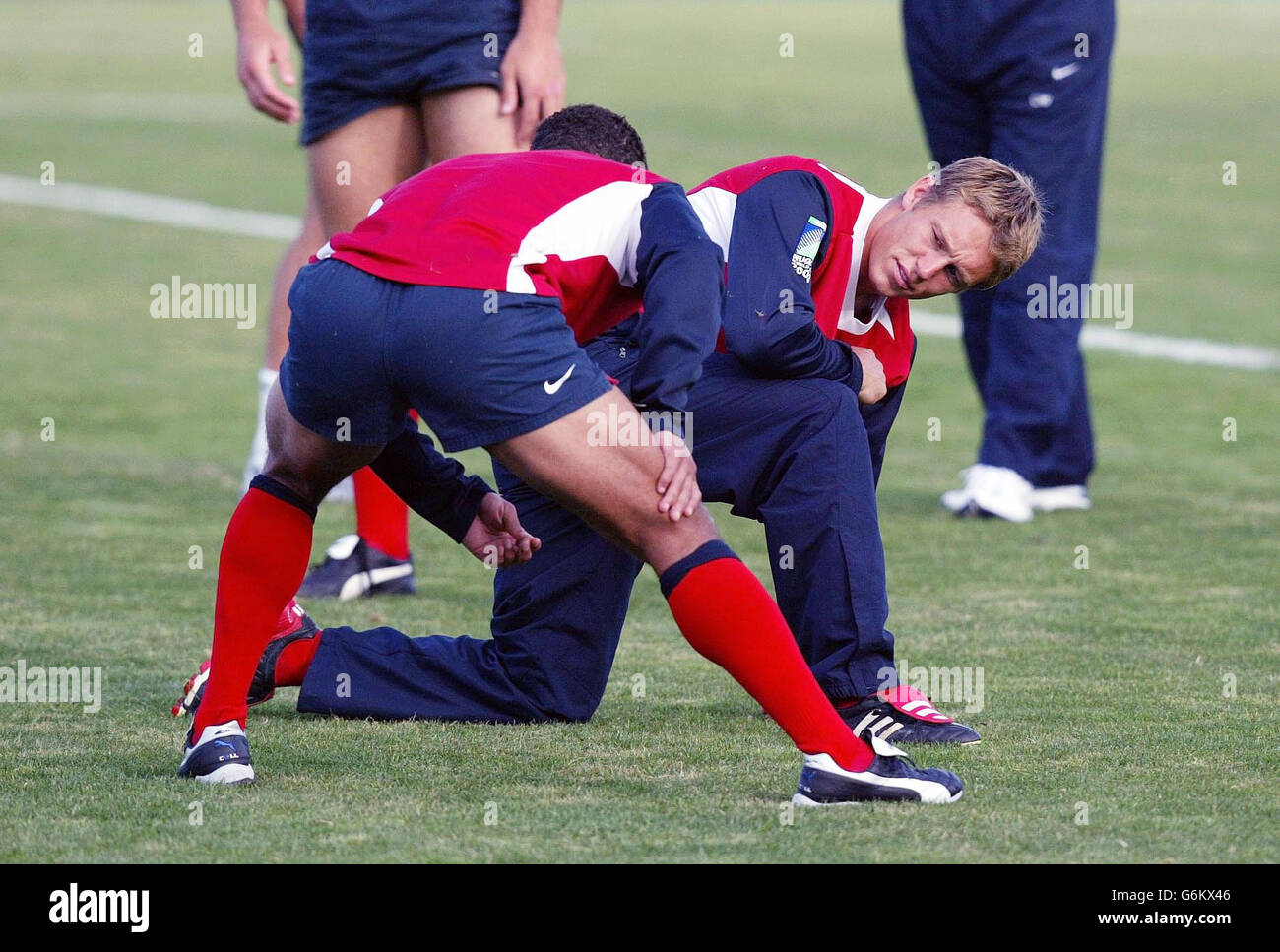 England's Jonny Wilkinson stretches with Jason Robinson during England ...