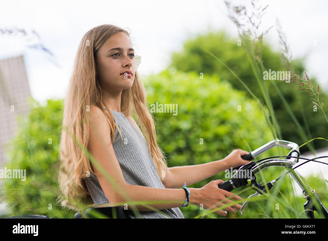 Young girl outside with her bike in the nature (MR Stock Photo - Alamy