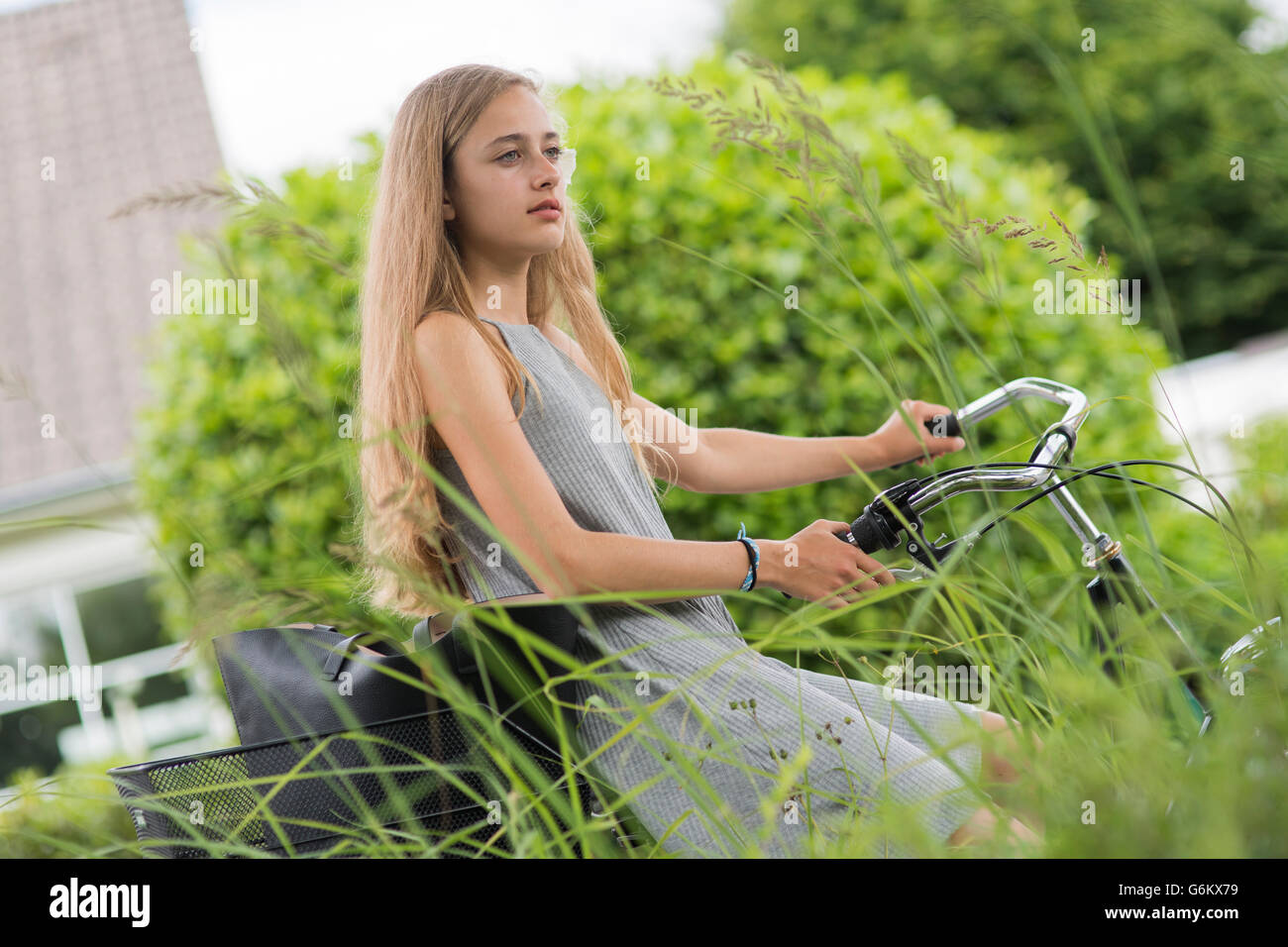 Young girl outside with her bike in the nature (MR Stock Photo - Alamy