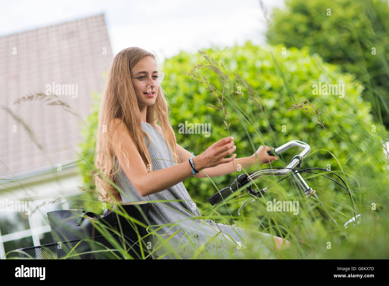 Young girl outside with her bike in the nature (MR Stock Photo - Alamy