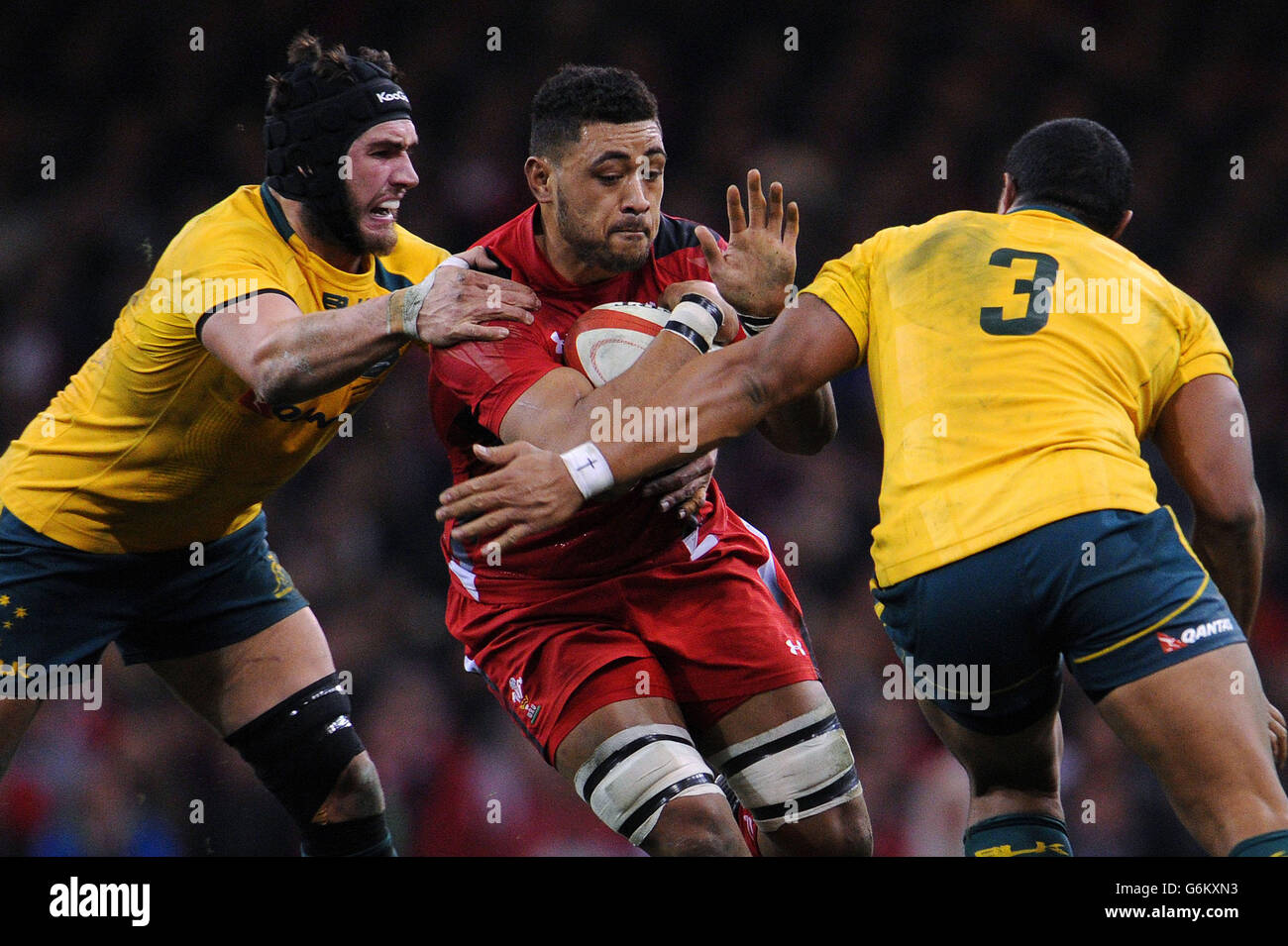 Wales' Toby Faletau is tackled by Australia's Rob Simmons (left) and ...