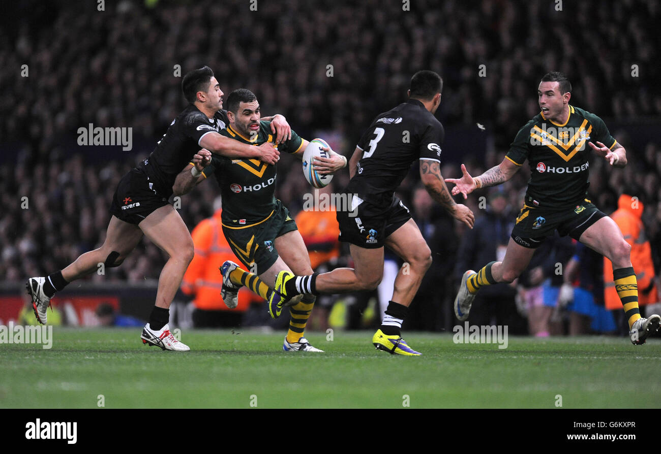Australia's Greg Inglis is tackled by New Zealand's Shaun Johnson ...