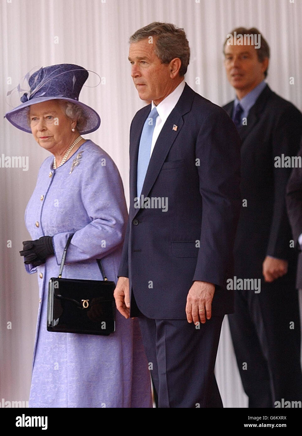 US President George Bush (C) welcomed to the United Kingdom by Queen ...