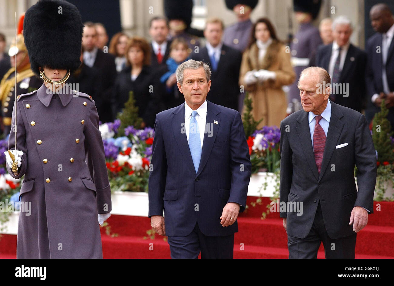 US President George Bush (C) walks with The Duke of Edinburgh (R ...