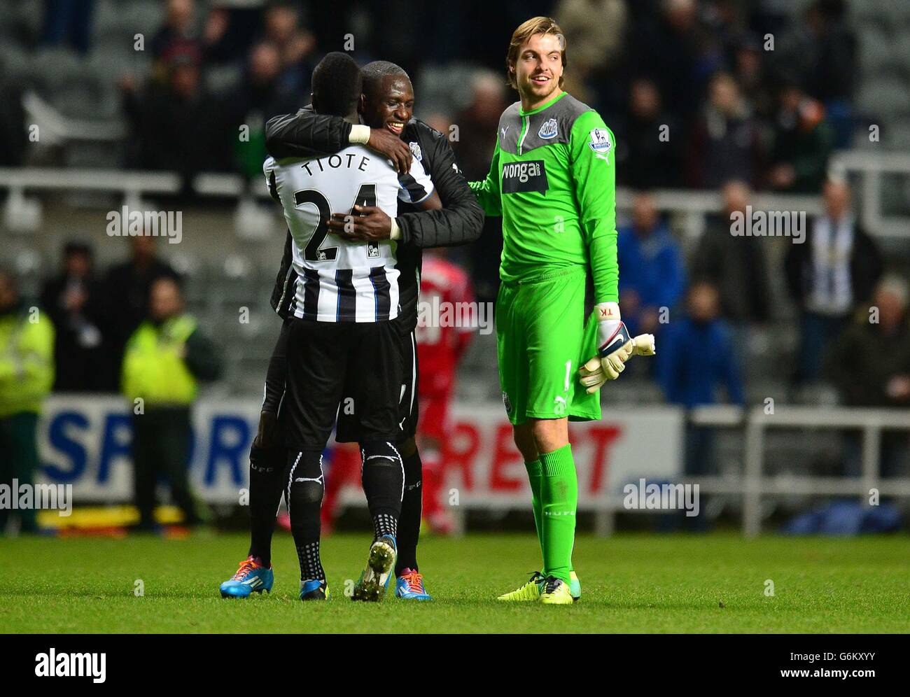 Newcastle United's Cheick Tiote gives goal scorer Moussa Sissoko a hug ...