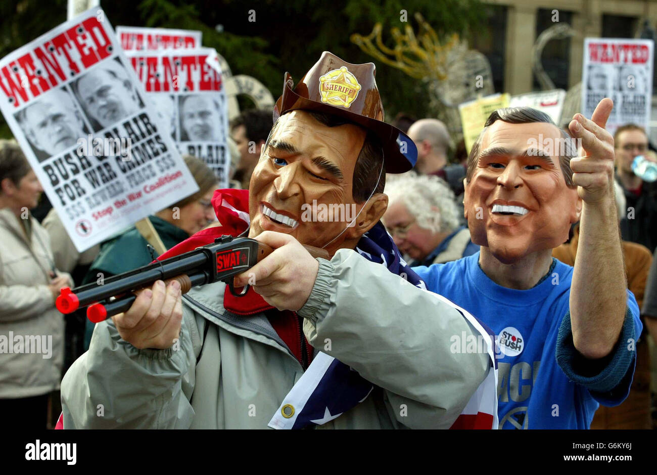 Protesters wearing President George Bush masks, demonstrate in George ...