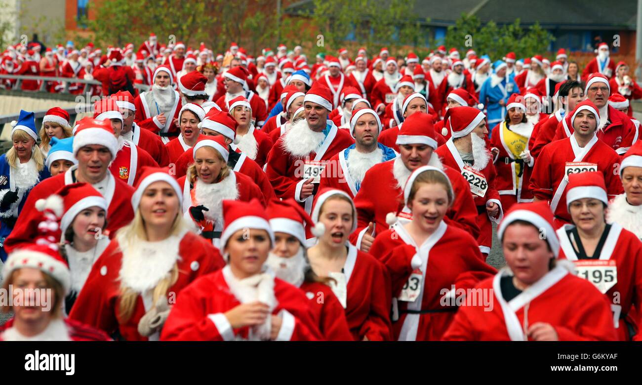 Runners dressed as Santa take part in the Liverpool Santa Dash, with an ...