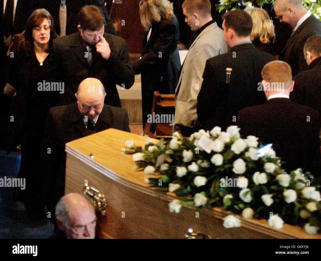 Luke Walmsley parents, Jayne and Paul, walk behind the his coffin as ...