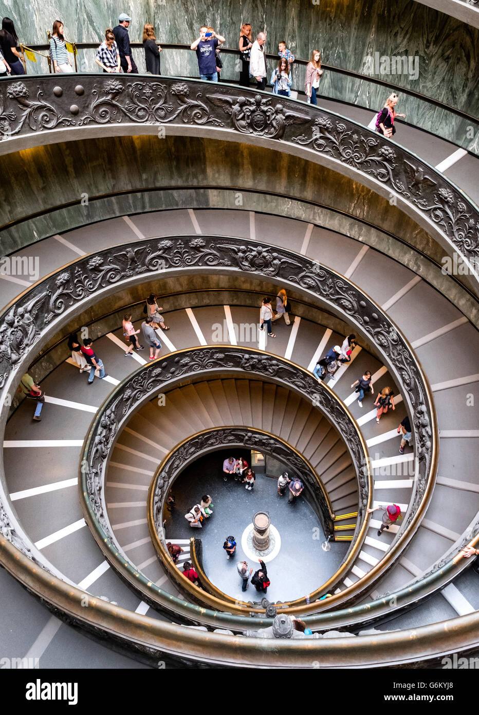Visitors descend the famous spiral staircase in the Vatican Museum in ...