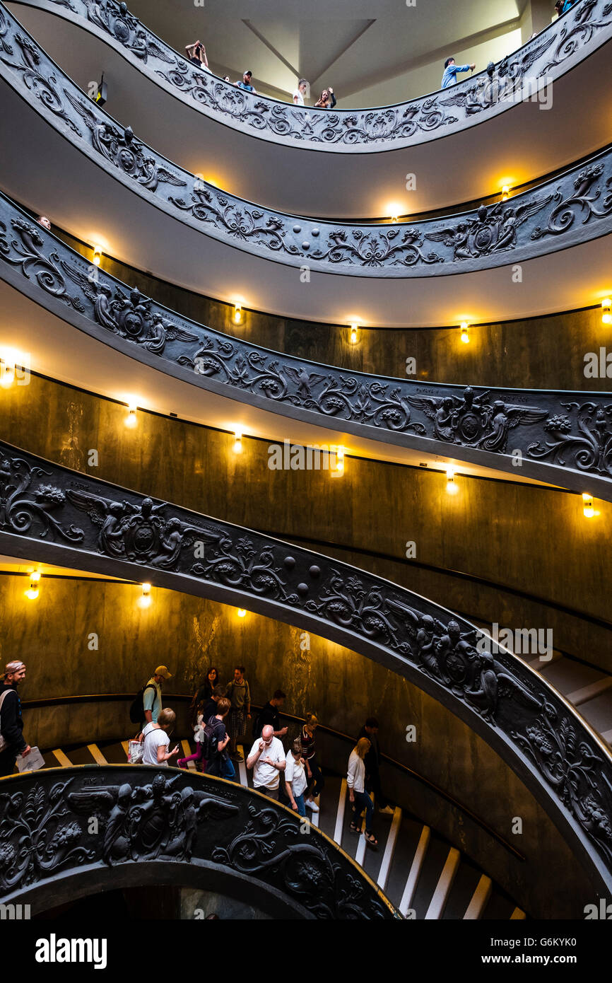 Visitors descend the famous spiral staircase in the Vatican Museum in ...
