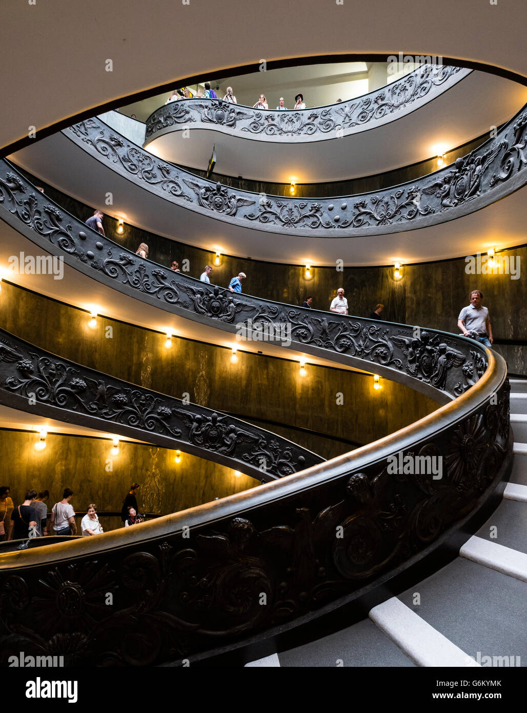 Visitors descend the famous spiral staircase in the Vatican Museum in ...