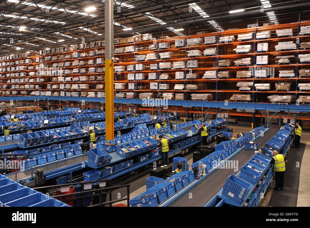 Workers prepare orders for delivery at the argos distribution centre hi ...