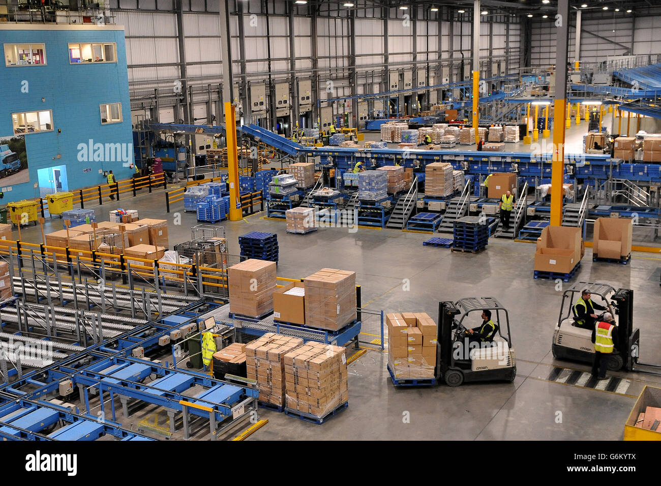 Workers prepare orders for delivery at the argos distribution centre hi ...