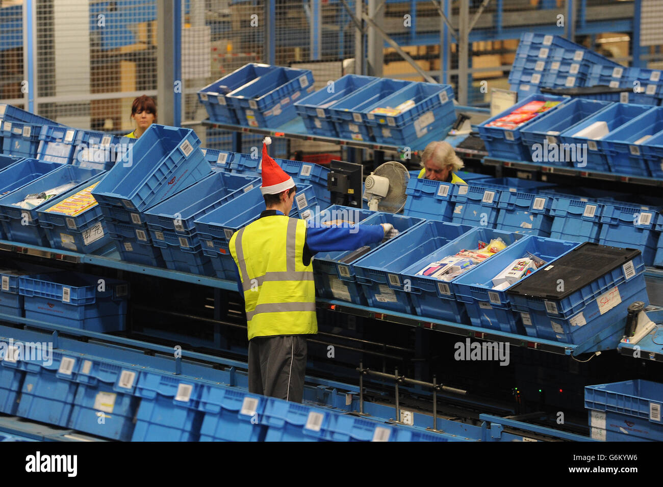 Workers prepare orders for delivery at the argos distribution centre hi ...