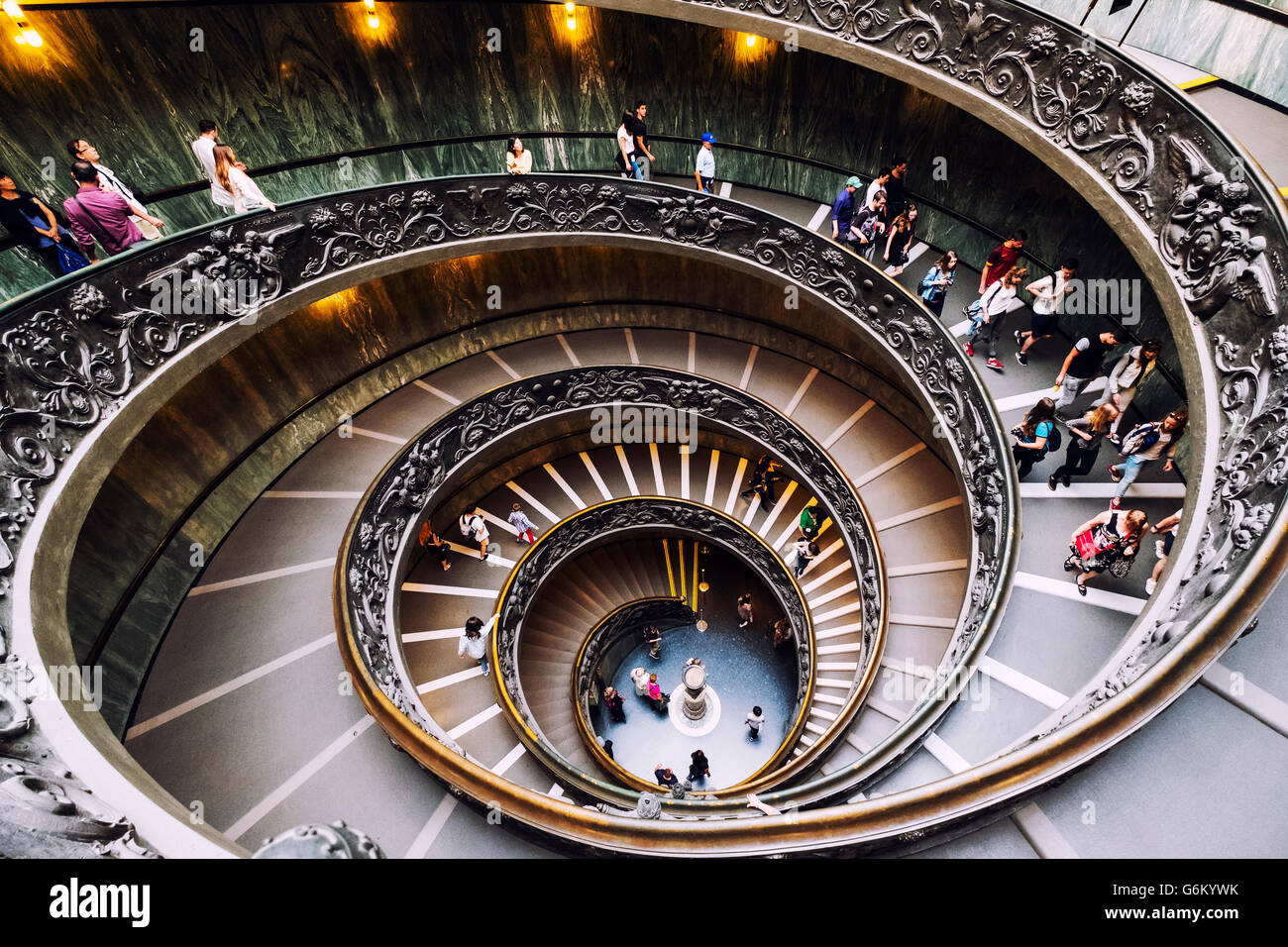 Visitors descend the famous spiral staircase in the Vatican Museum in ...