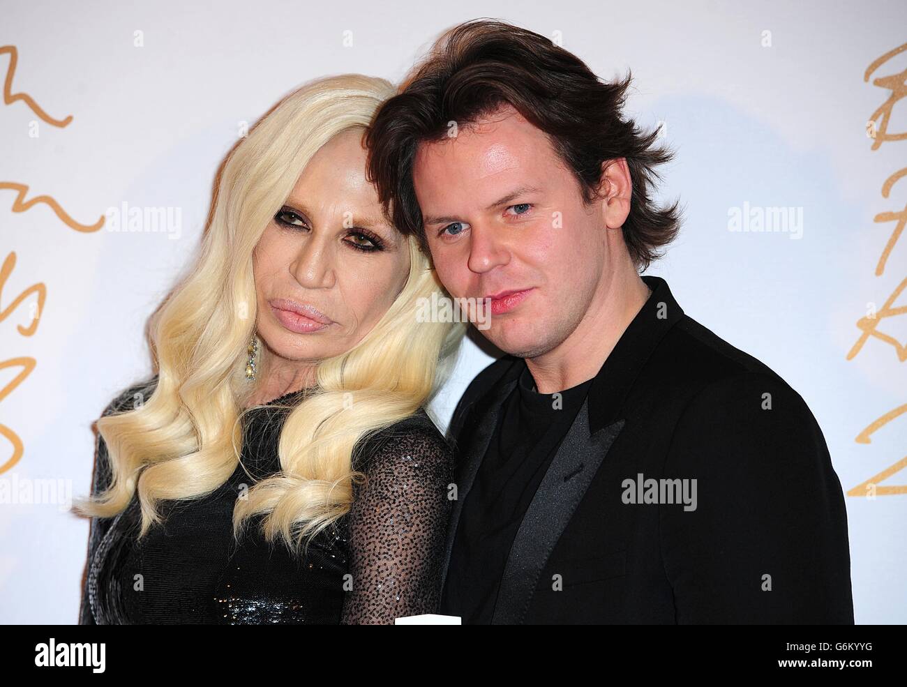 Donatella Versace and Christopher Kane with the award for womenswear ...