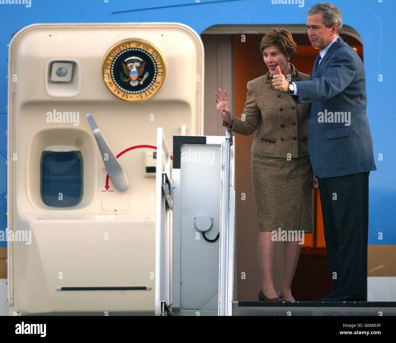 President George W. Bush and his wife, Laura, before departing from ...