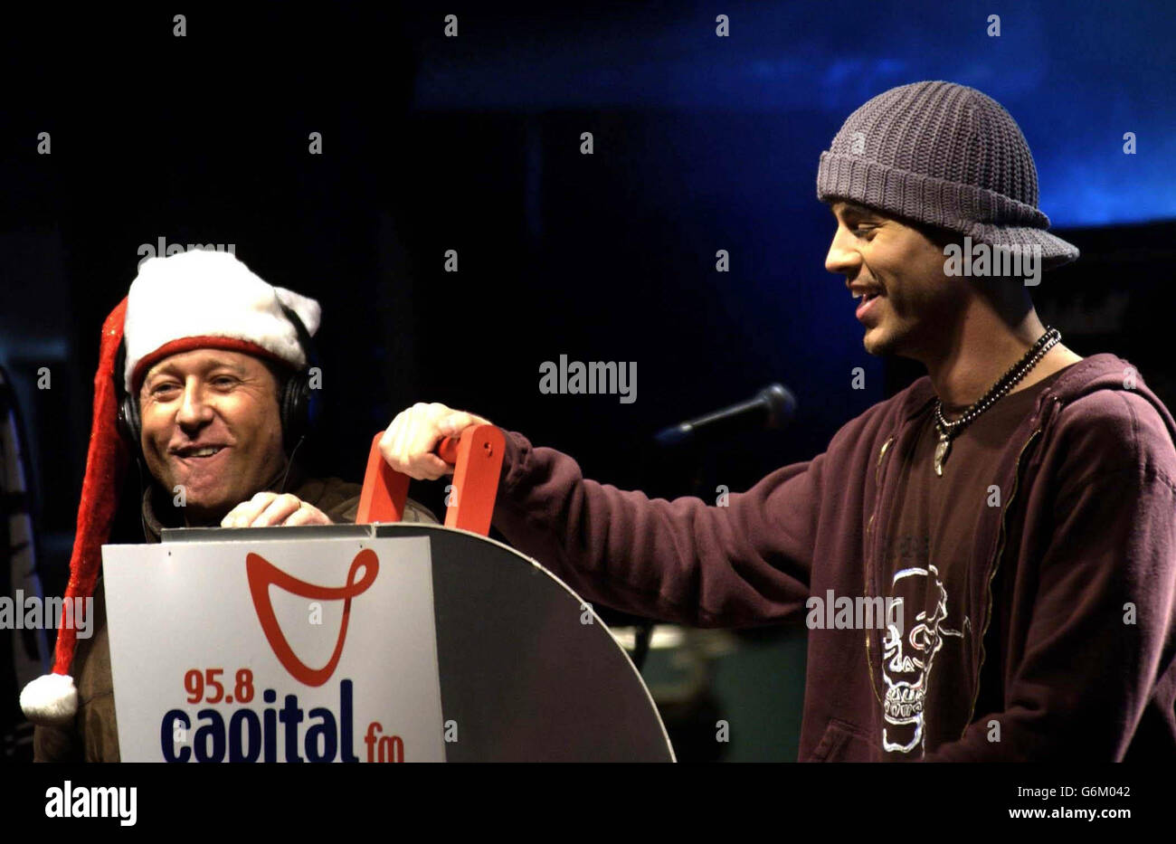 DJ Neil Fox (left) with singer Enrique Iglesias as he switches on the ...