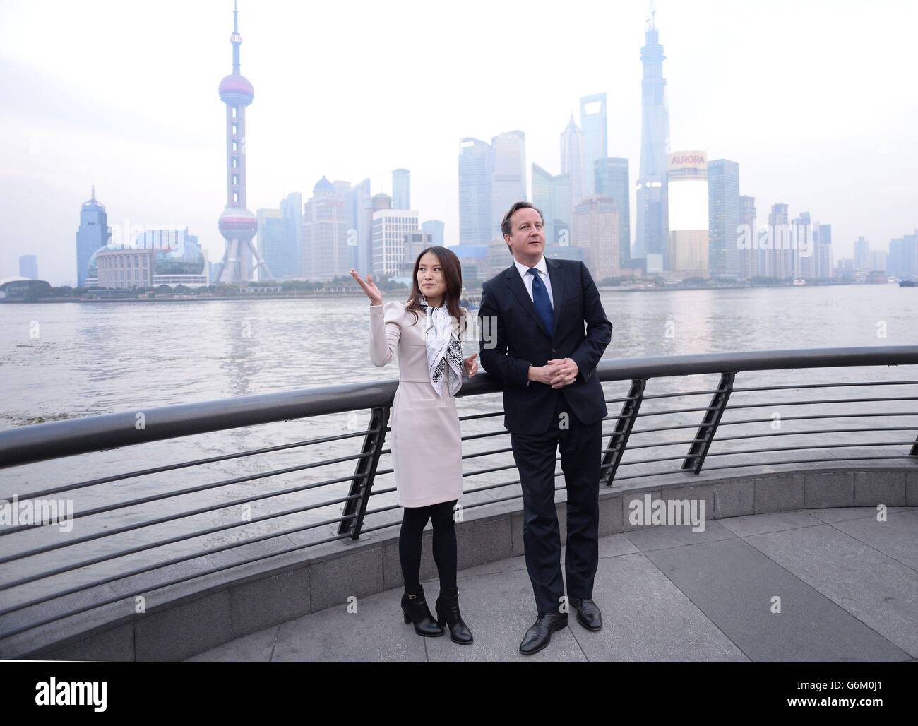 Prime Minister David Cameron walks along The Bund with Lisa Pan, Vice ...