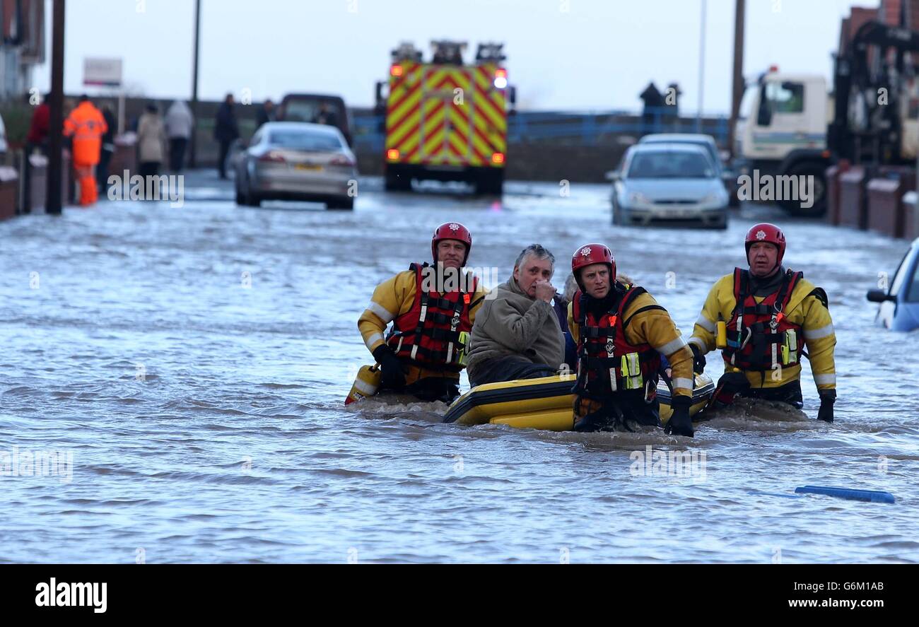 People are rescued by the RNLI from the floods in Rhyl as heavy seas ...