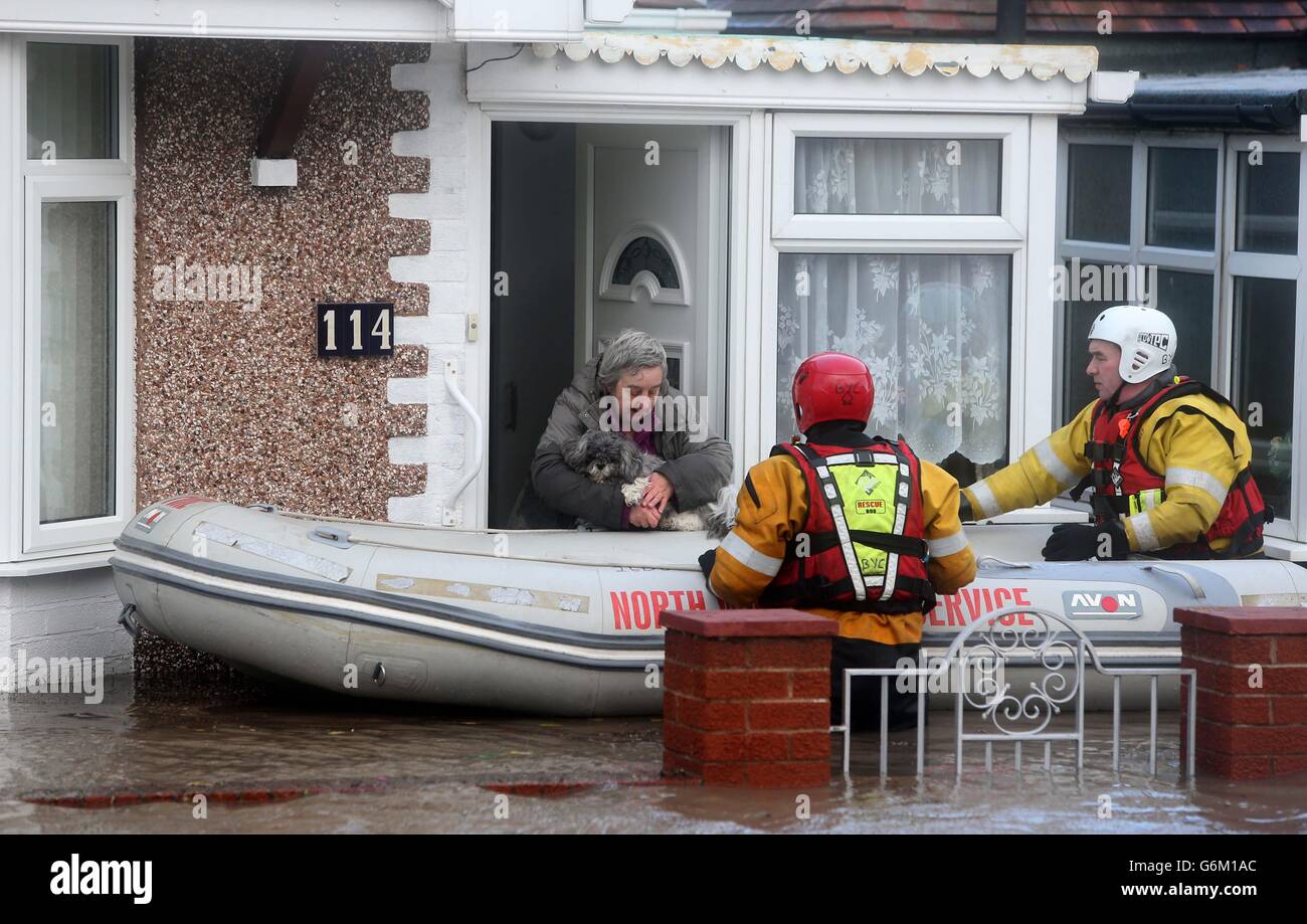 People are rescued by the RNLI from the floods in Rhyl as heavy seas ...