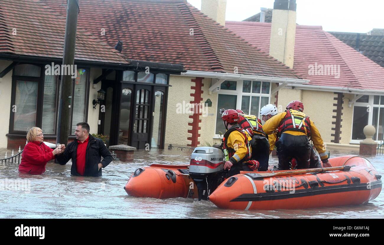 People are rescued by the RNLI from the floods in Rhyl as heavy seas ...