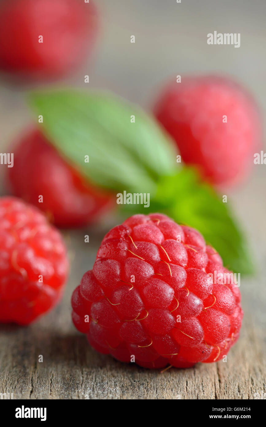 Details of wild raspberry on wooden table Stock Photo - Alamy