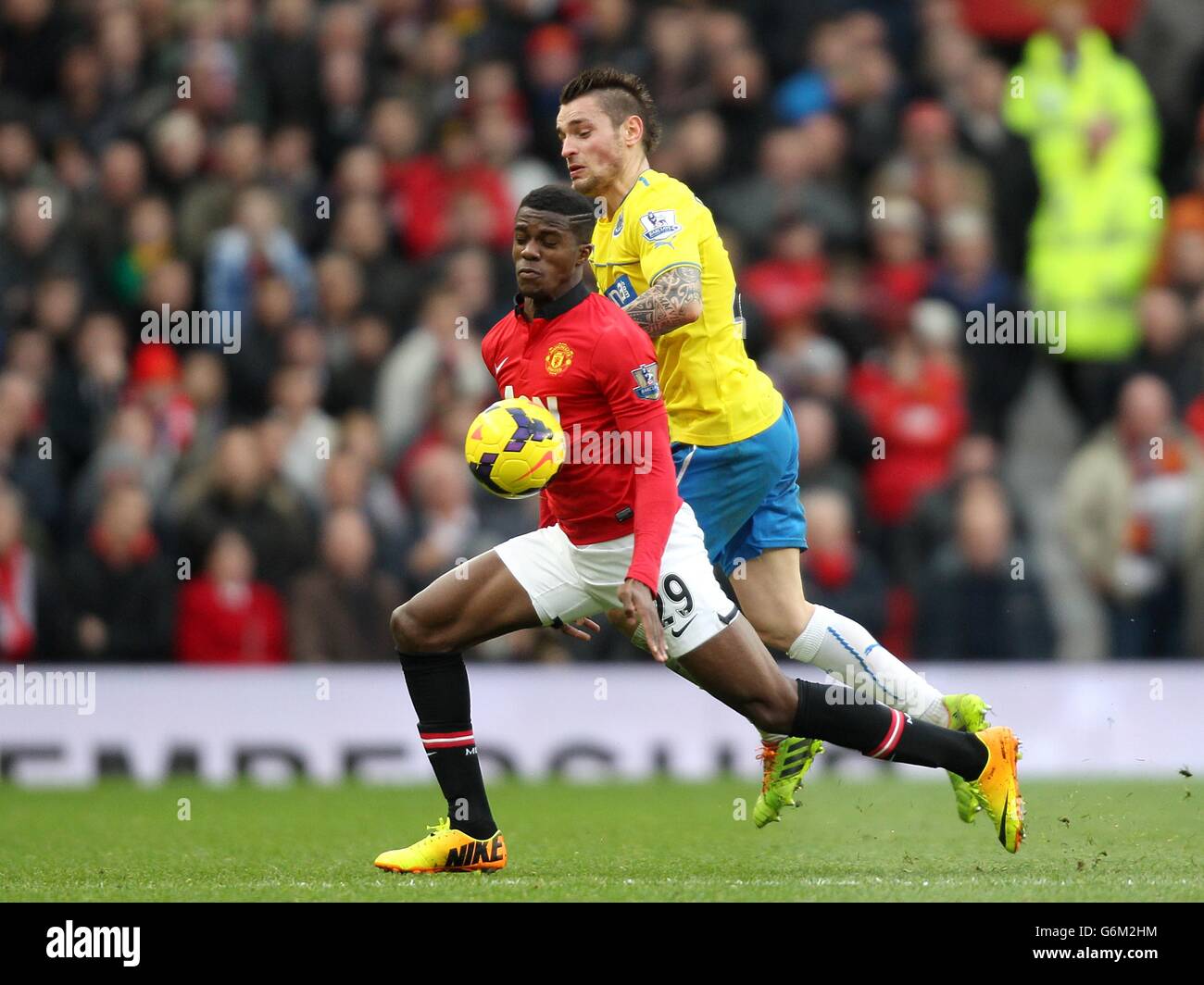 Manchester United's Wilfried Zaha (left) and Newcastle United's Mathieu ...