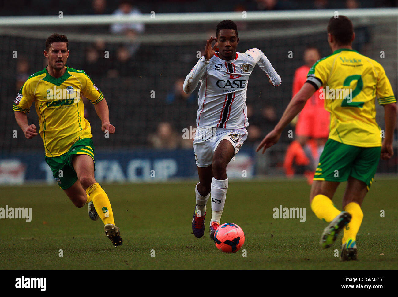 Dover Athletic's James Rogers (left) and MK Dons Jason Barton (centre ...