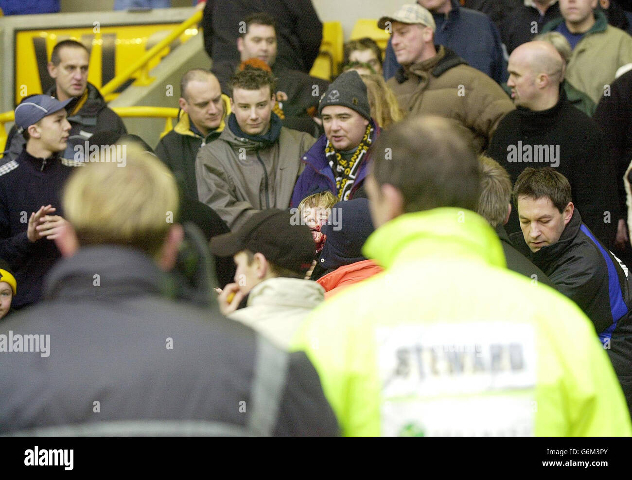 A female Wolves fan is carried from the crowd after being injured by a ...