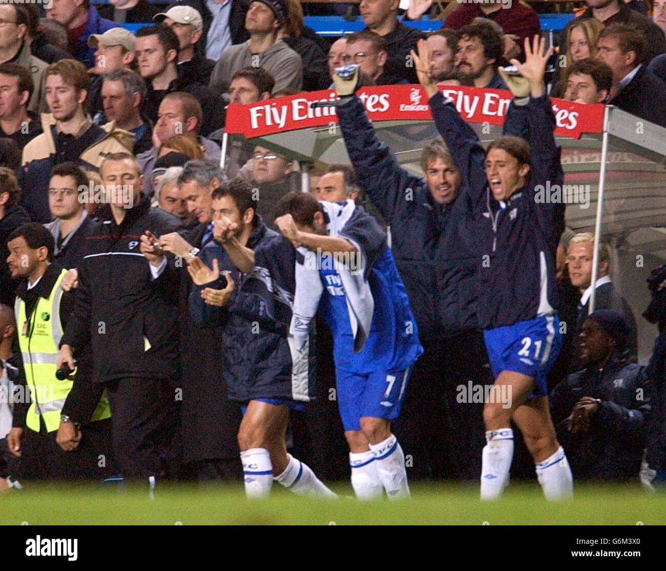 The Chelsea bench celebrate the final whistle as they defeat Manchester ...