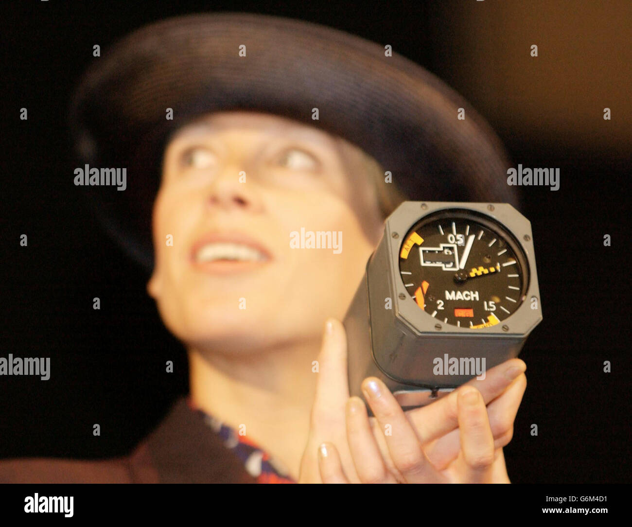 British Airways cabin crew member Emma Ridges holds up a Concorde ...