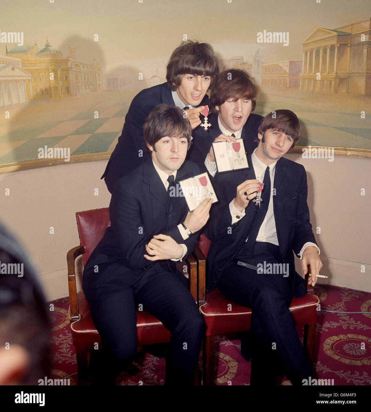 The Beatles display their MBEs at the Saville Theatre, after receiving ...