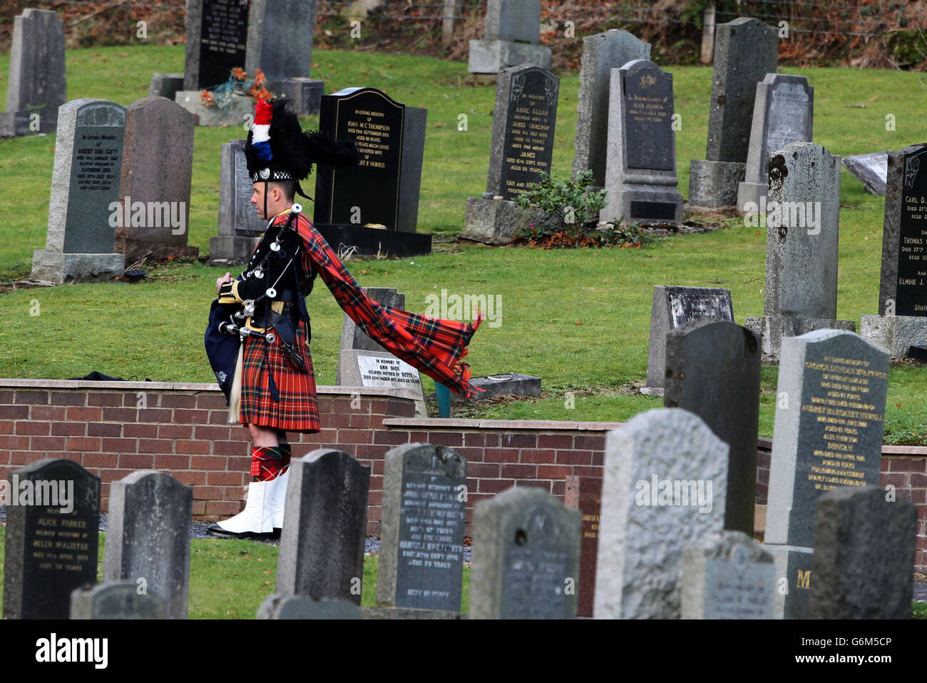 A piper arrives for the funeral of Police Constable Tony Collins, at ...