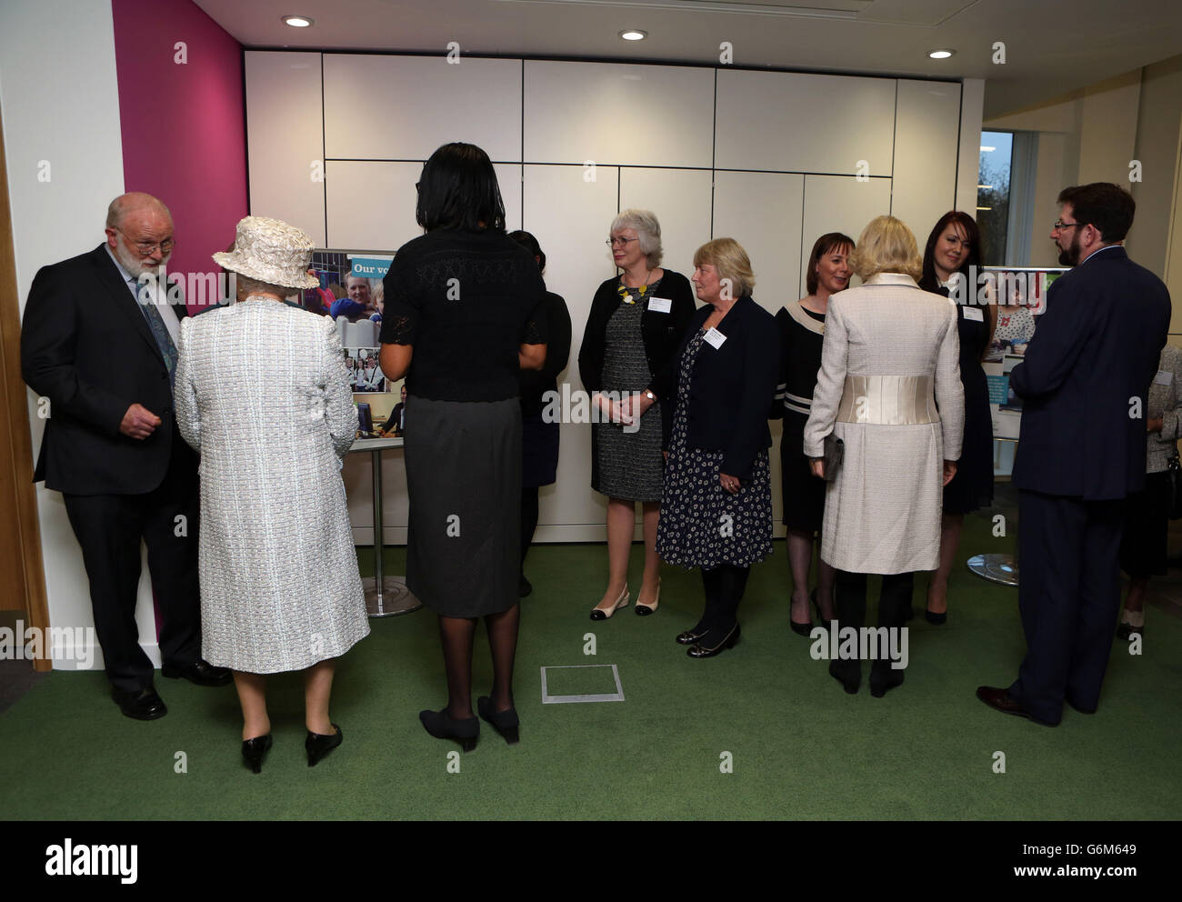 Queen Elizabeth II and The Duchess of Cornwall meet staff as they tour ...