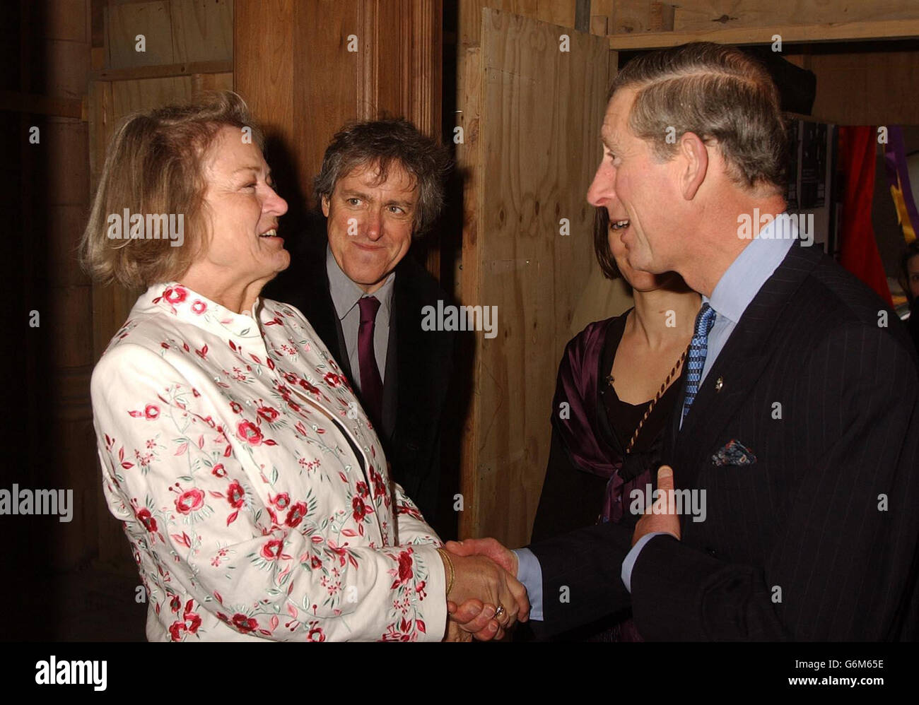The Prince of Wales shakes hands with TV reporter Kate Adie, as ...