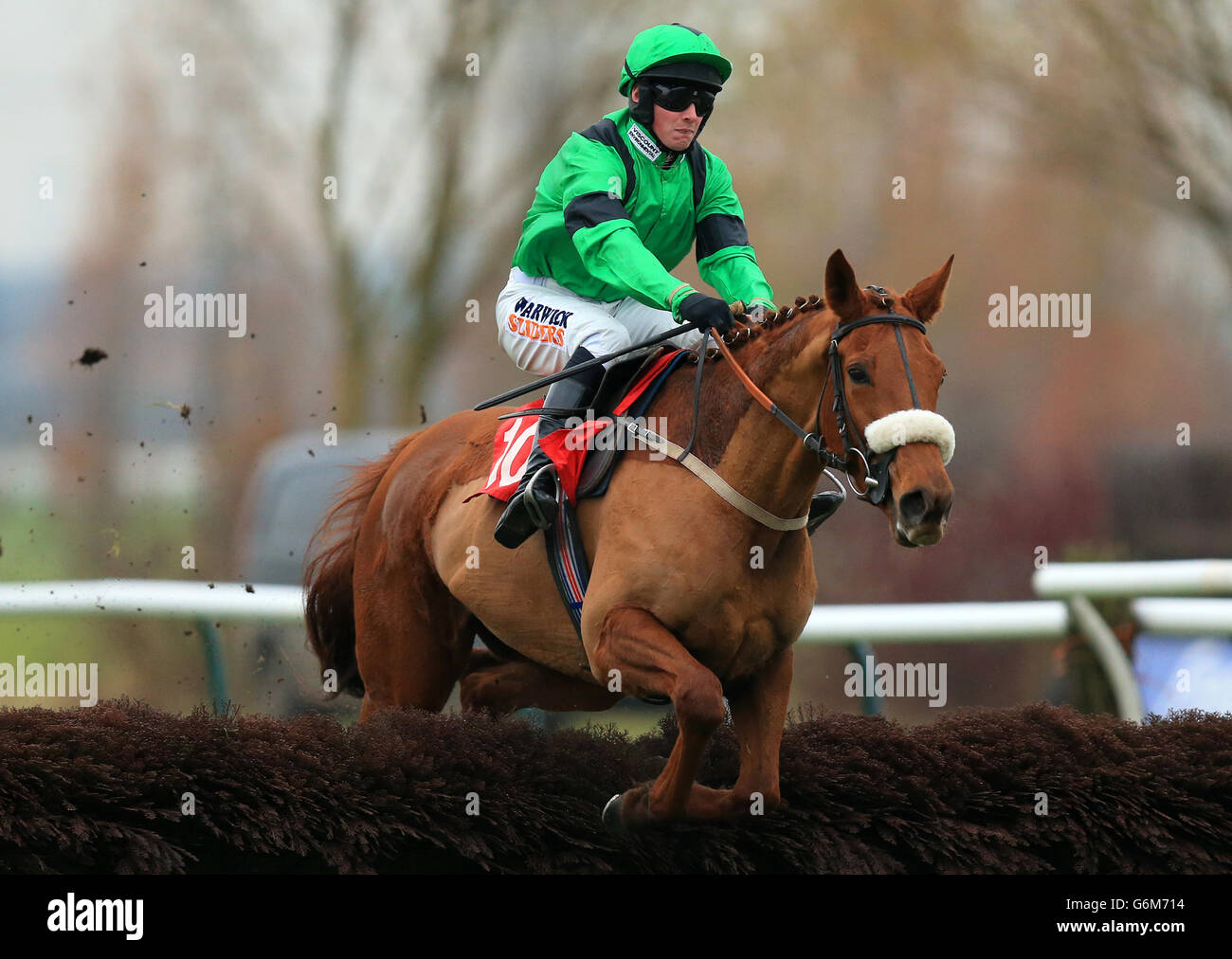 Jockey Jack Quinlan on So Cheeky jumps a hedge during the 32RedBingo ...