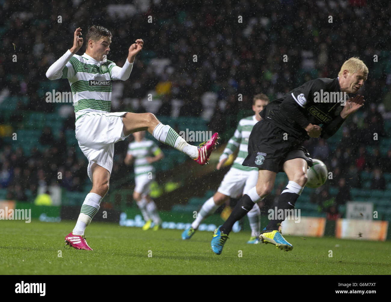 Celtic's Mikael Lustig (left) Hibernian's Ryan McGivern during the ...