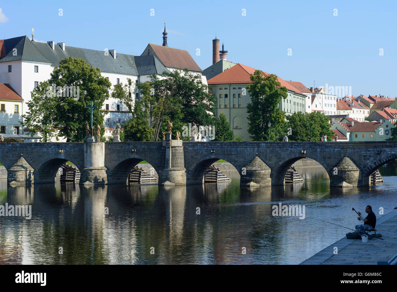 Stone bridge over the Otava River and Old Town, Pisek, Czech Republic ...