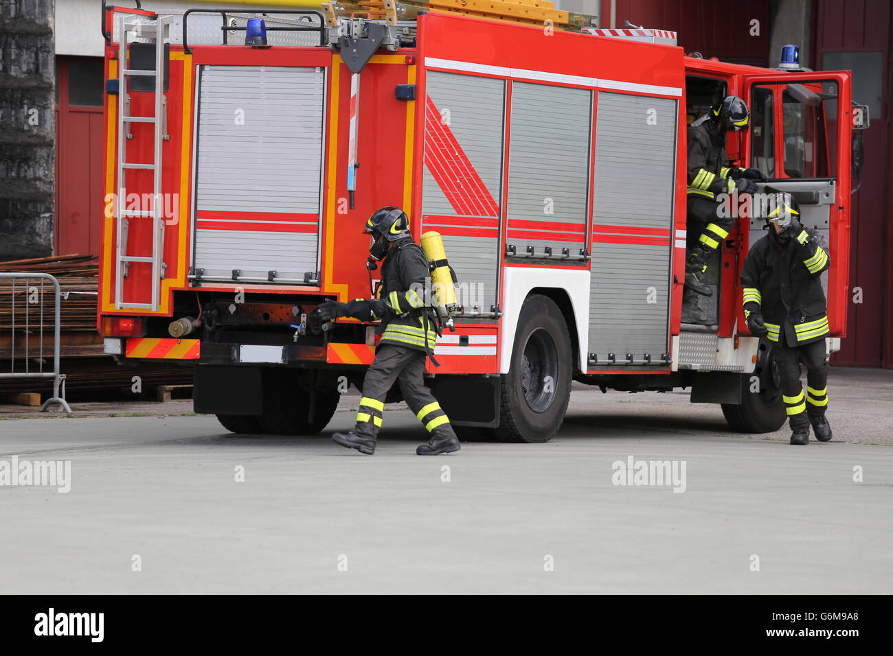 fire engine with many firefighters for fighting large fire Stock Photo ...