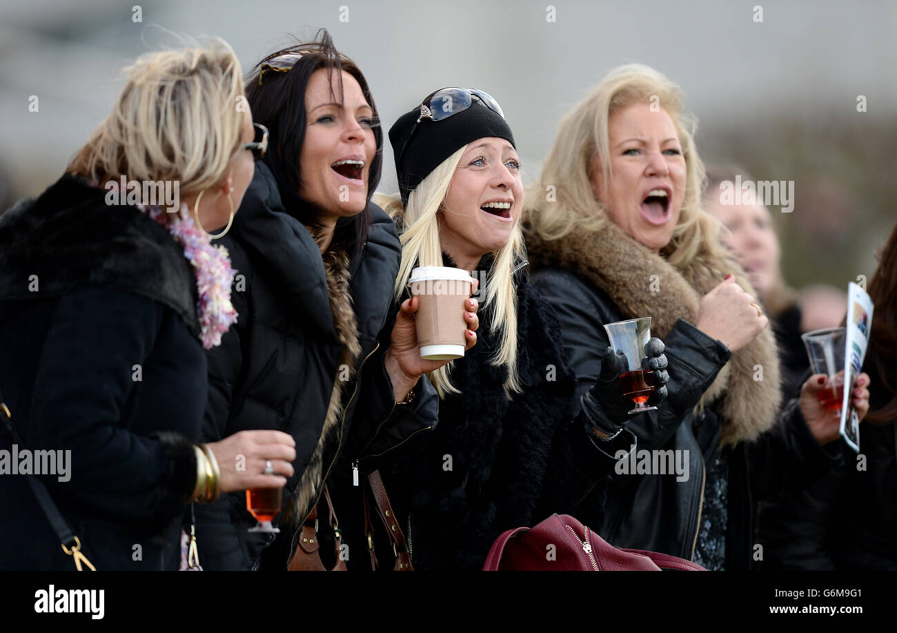 Female Racegoers cheer on their horses on Day 1 of the Tingle Creek ...